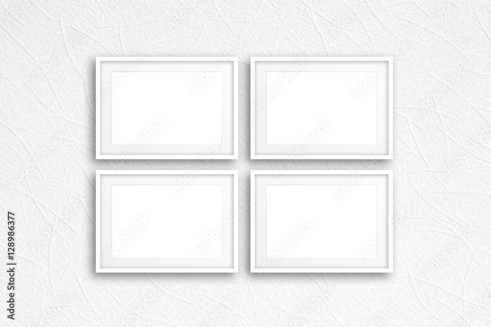 Four blank photo frames on modern textured wallpaper, interior decor ...