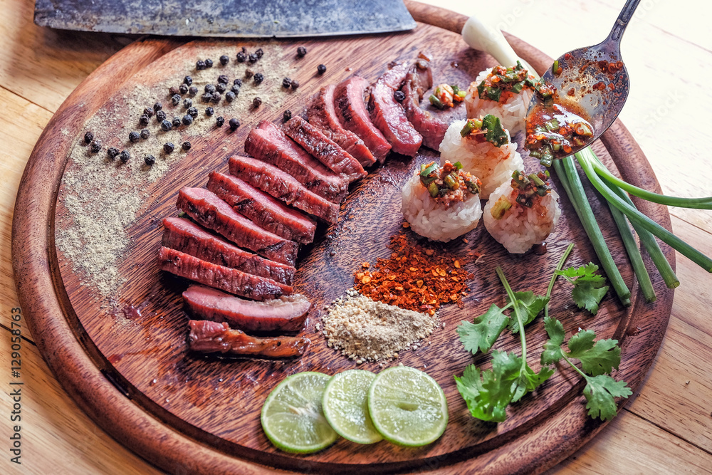 Thai-Style Grilled Steak (Neua Yang) served with sticky rice and chili ...