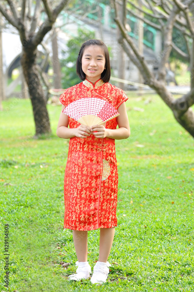 12 years old Asian girl in red Chinese new year Dress post profi Stock ...