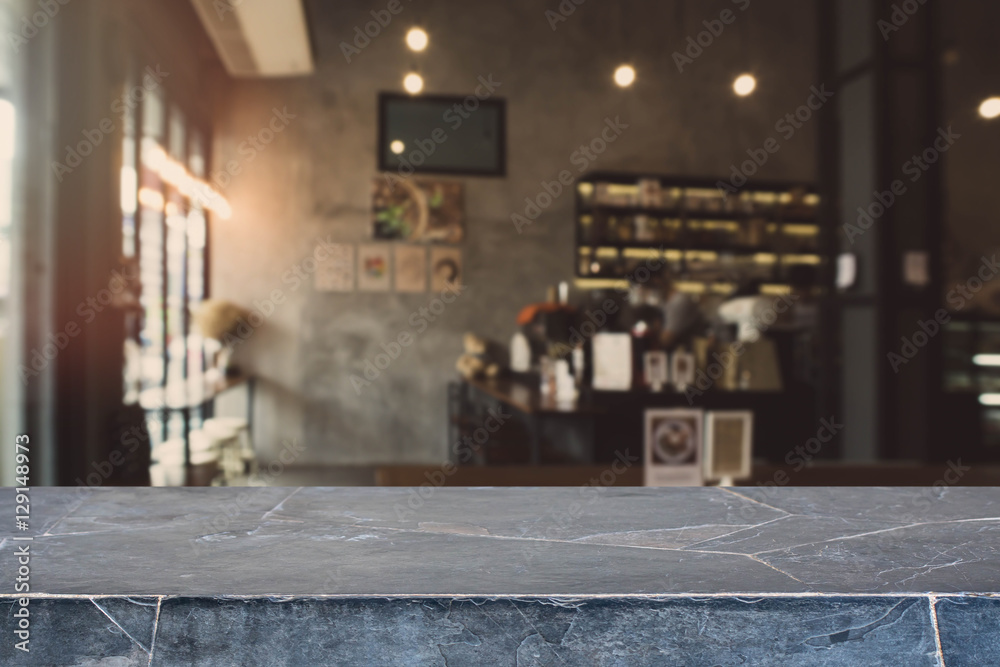 Stone table top and blurred bokeh cafe and coffee shop interior ...