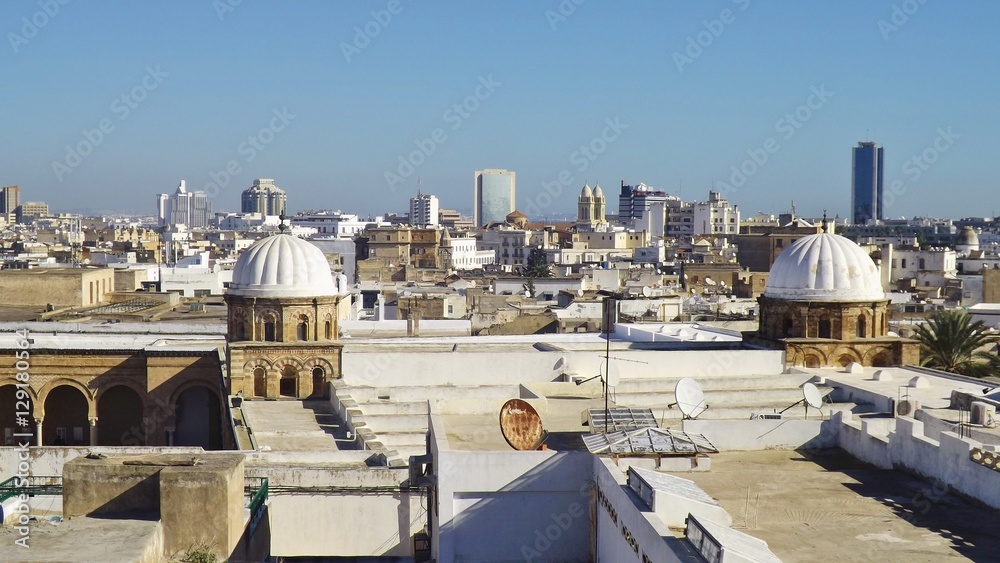 View of part of the Al-Zaytuna Mosque and the skyline of modern Tunis ...