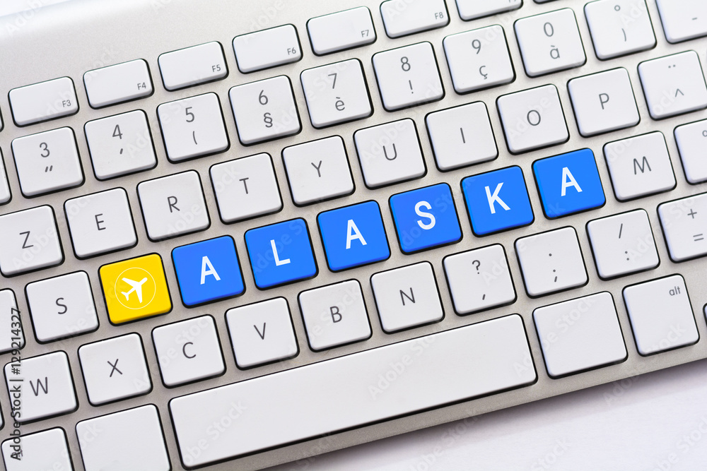 ALASKA writing on white keyboard with a aircraft sketch Stock ...