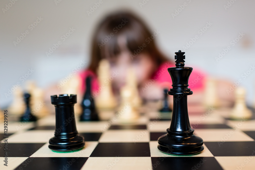 Girl and chess board Stock Photo | Adobe Stock