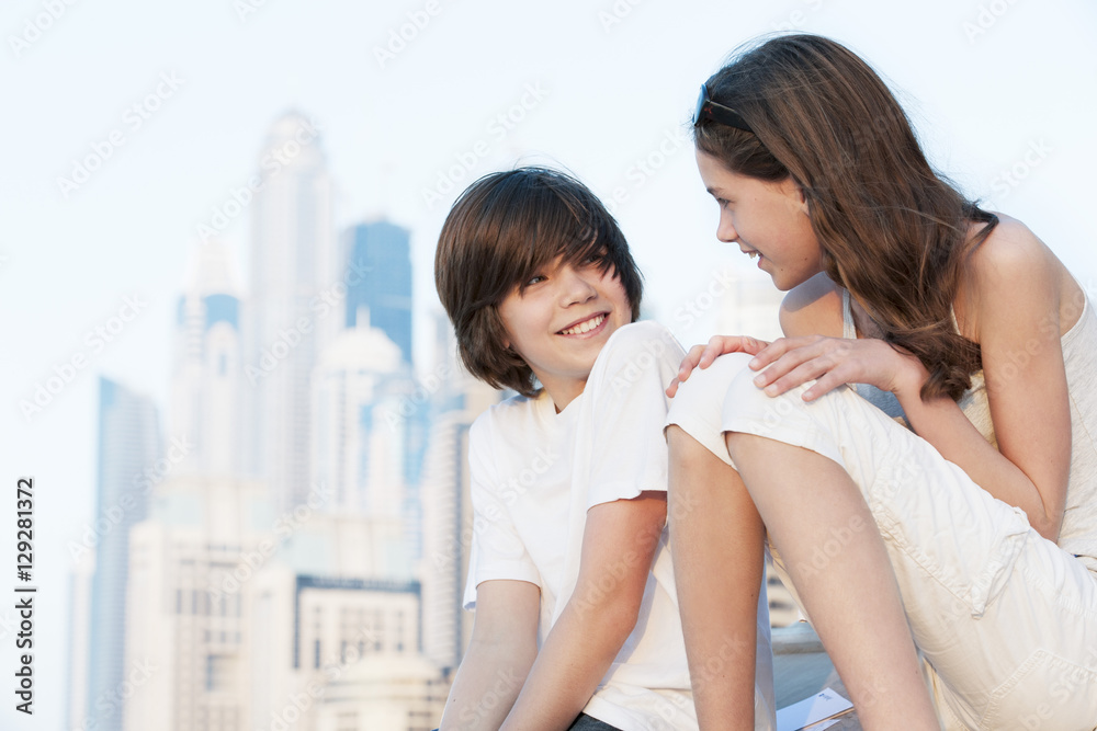 Brother and sister talking together outdoors Stock Photo | Adobe Stock