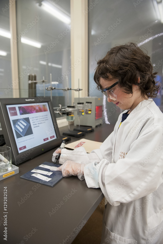 Boy enjoying interactive exhibit at science museum Stock Photo | Adobe ...