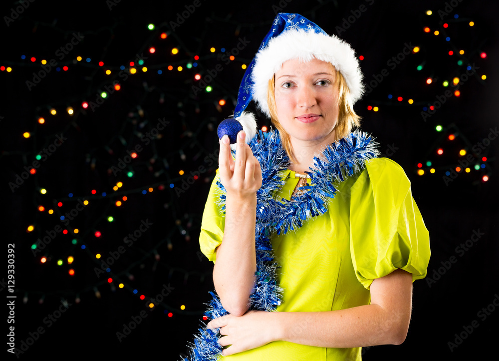 pretty lass wearing green dress and xmas blue cap with Christmas blue ...