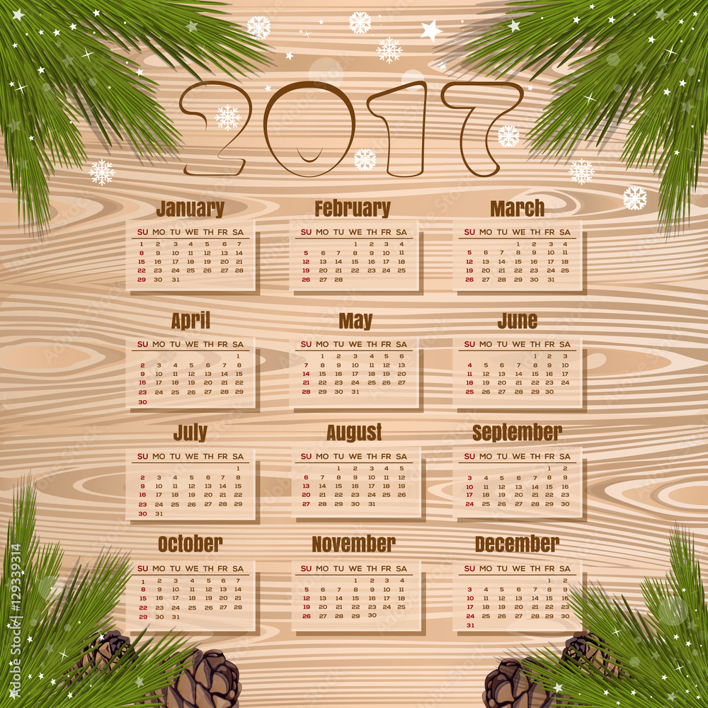 Calendar for 2017 on a wooden background in a frame of fir branches ...