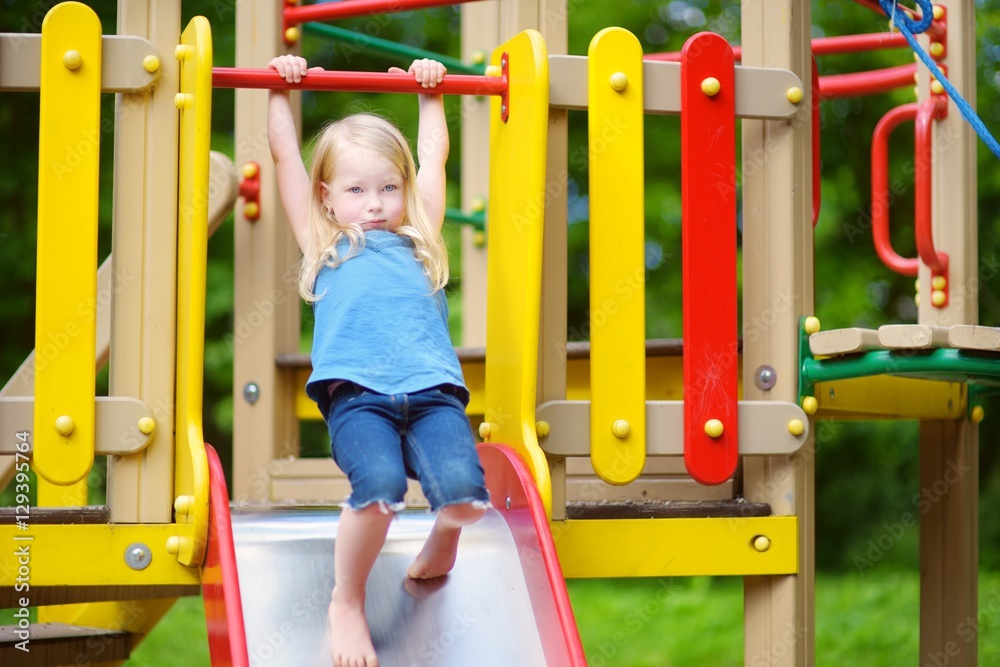 Cute little girl having fun on a playground Stock Photo | Adobe Stock