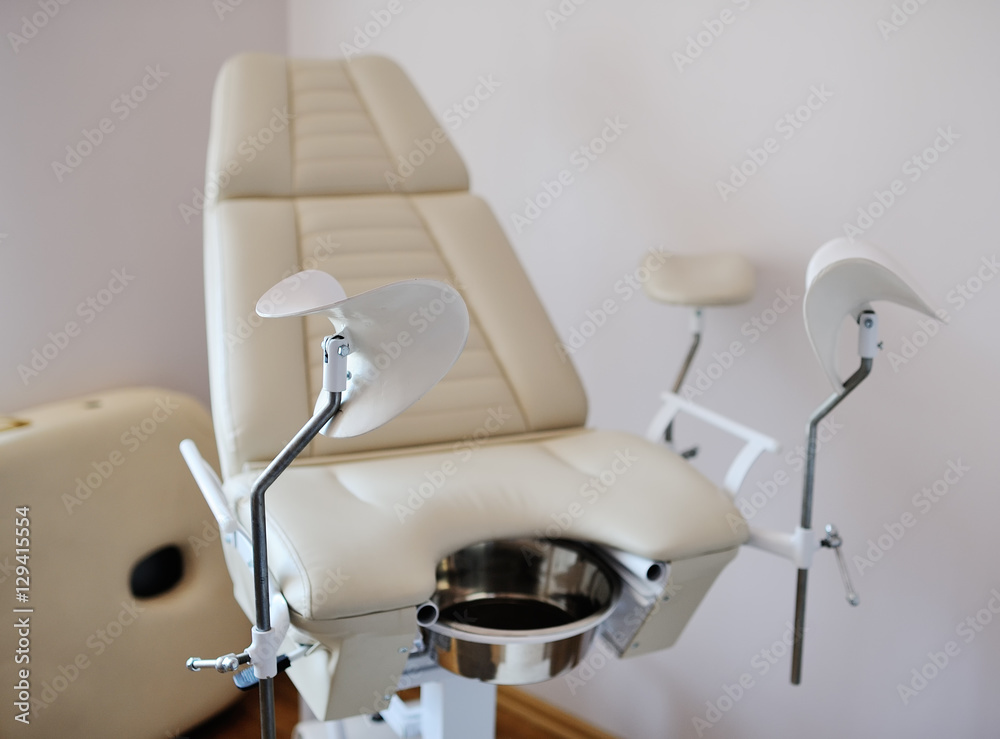 beautiful modern gynecological chair a light beige color in the clinic ...