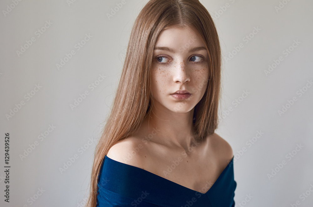 Beauty Theme Portrait Of A Beautiful Young Girl With Freckles On Her