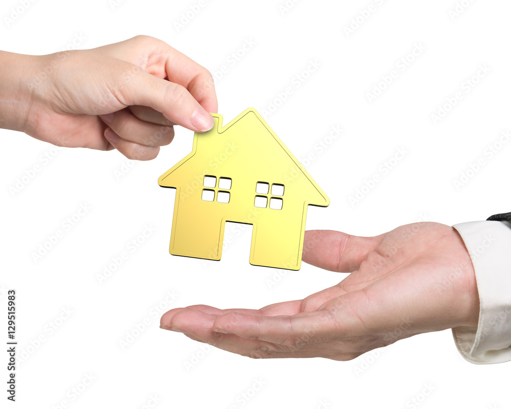 One hand giving golden house to another hand Stock-Foto | Adobe Stock
