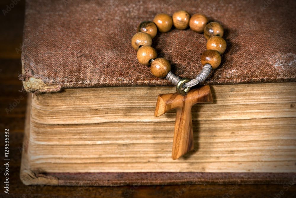 Tau, wooden cross symbol of St. Francis of Assisi with rosary bead and ...