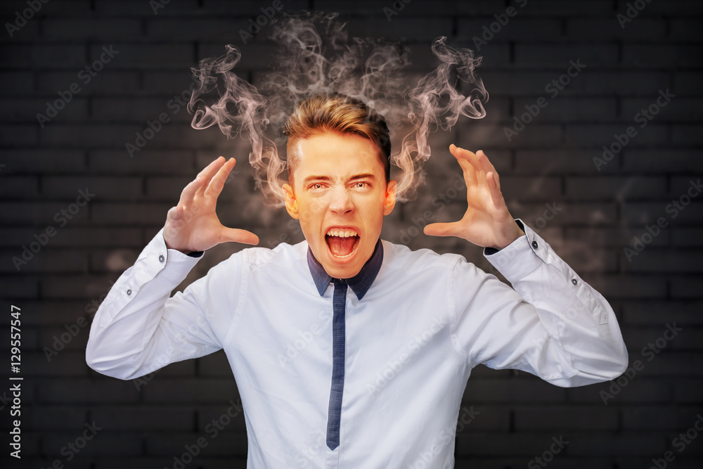 Angry man screaming with smoke coming out of his ears Stock-Foto ...