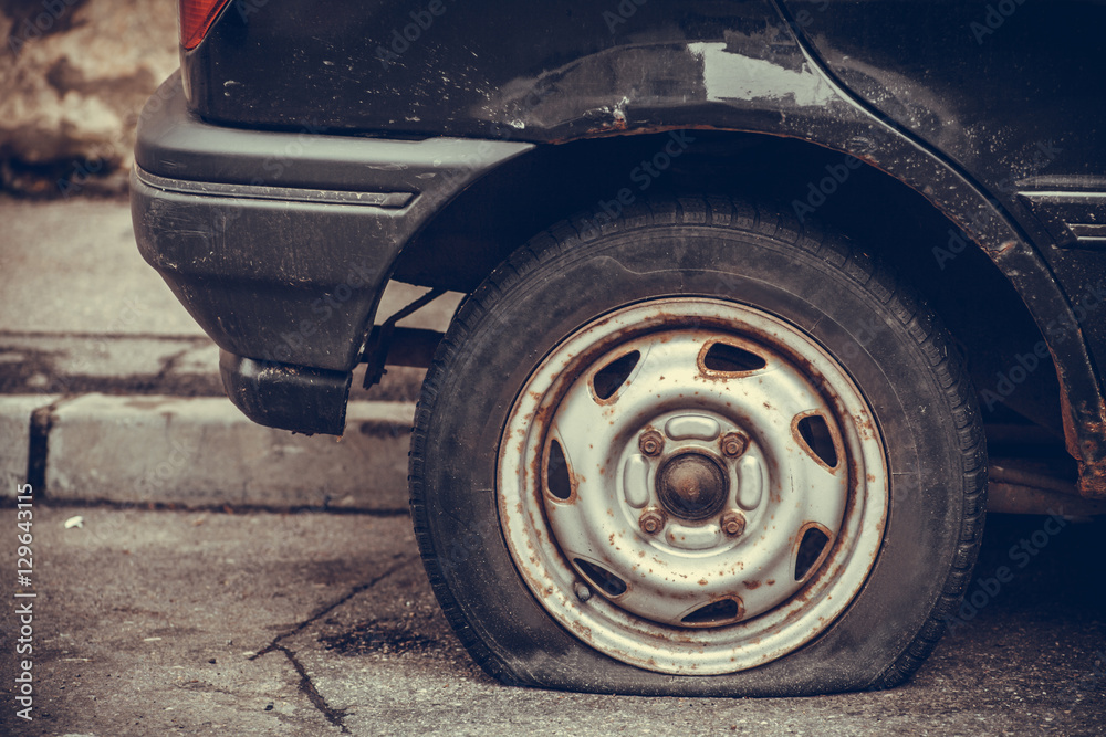 Car flat tire Stock Photo | Adobe Stock