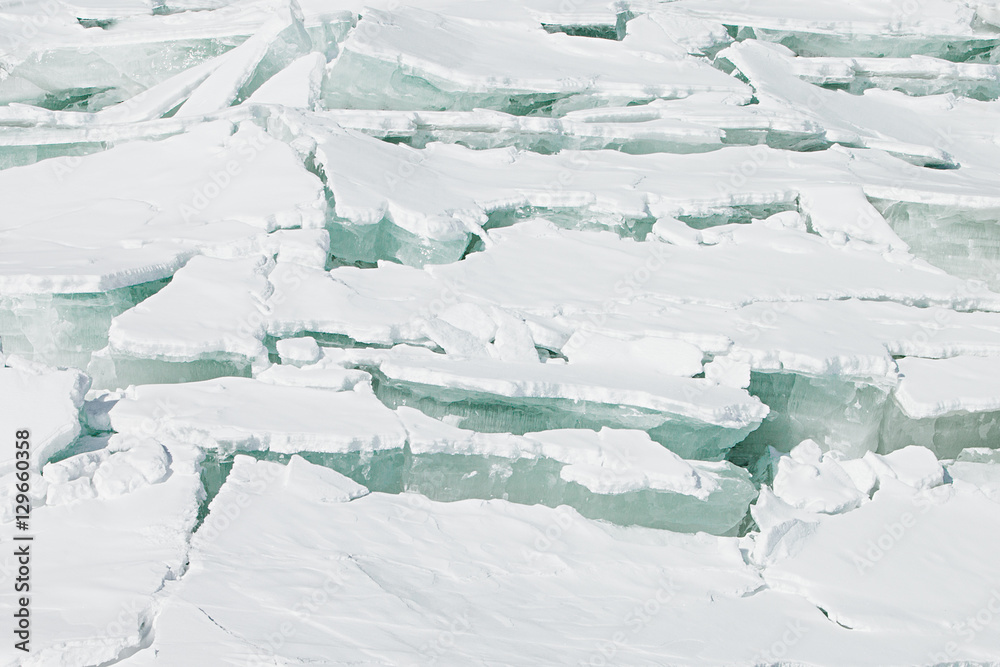 Ice background of huge blocks of aqua ice from fractured floes. Winter ...