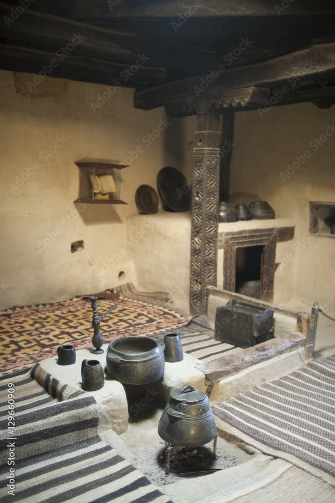 A ancient style kitchen with stone pots on display in a museum in the ...