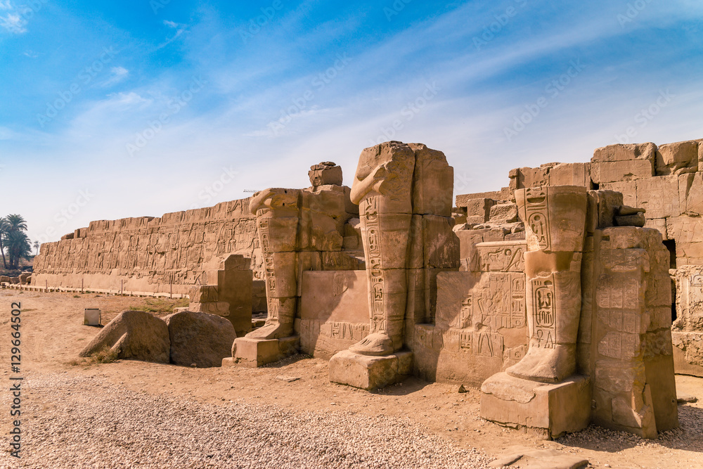 LUXOR, EGYPT: Ancient ruins of Karnak temple in Egypt at noon. The ...