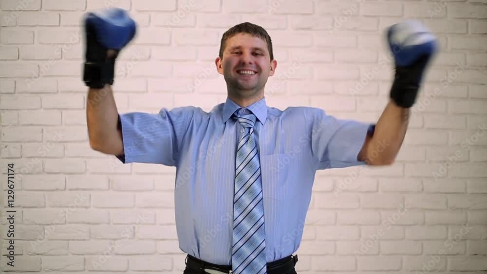 Businessman with boxing gloves celebrating the victory. Man in boxing ...