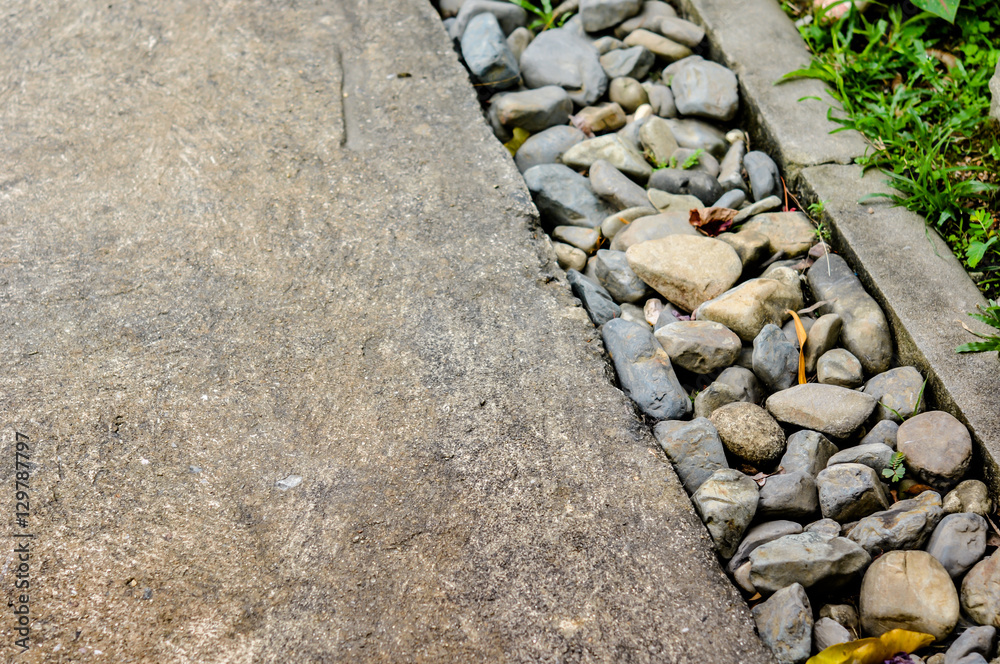 rainwater drainage system walkway build by pebbles in a park Stock ...