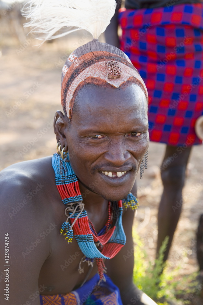 Portrait of a Hamer tribesman with ornate hairstyle of ochre and resin ...