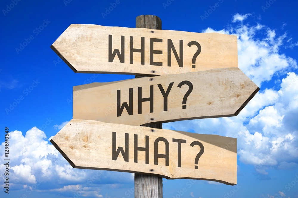 When, why, what - frequently asked questions concept - wooden signpost ...