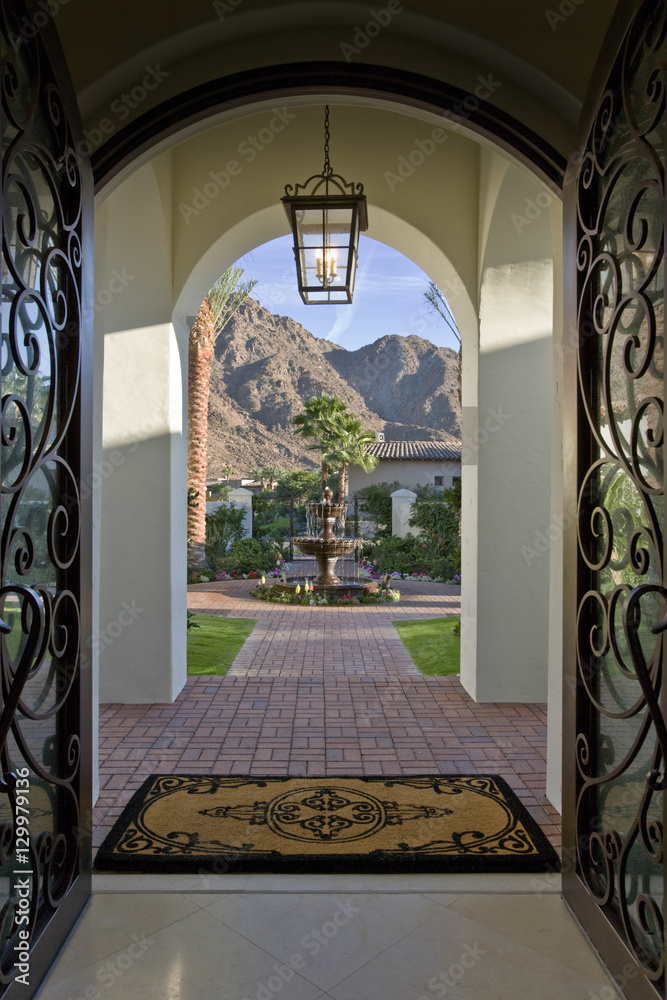 Entrance hall of an elegant house with open gates Stock Photo | Adobe Stock