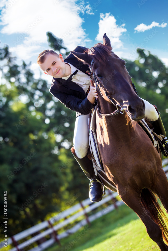 Portrait of confident man riding horse on field Stock Photo | Adobe Stock
