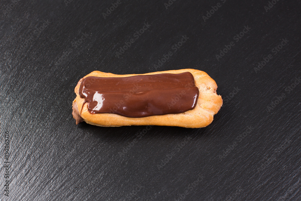 Chocolate eclair on black background. Eclairs with glaze. Stock-Foto ...