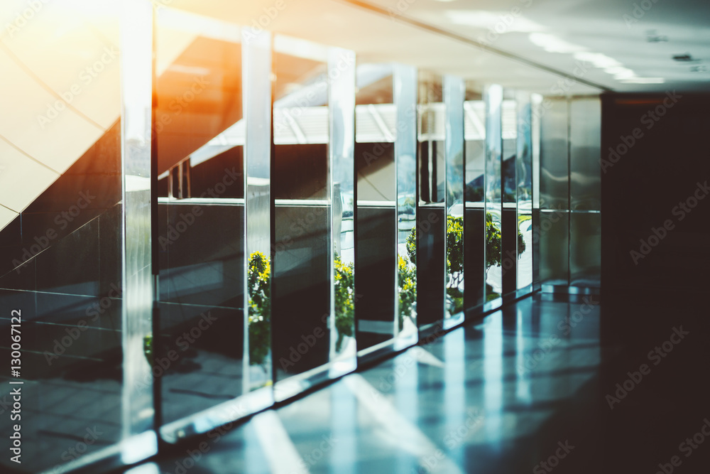 Abstract dark office interior background, the sun rays, glass, chrome ...