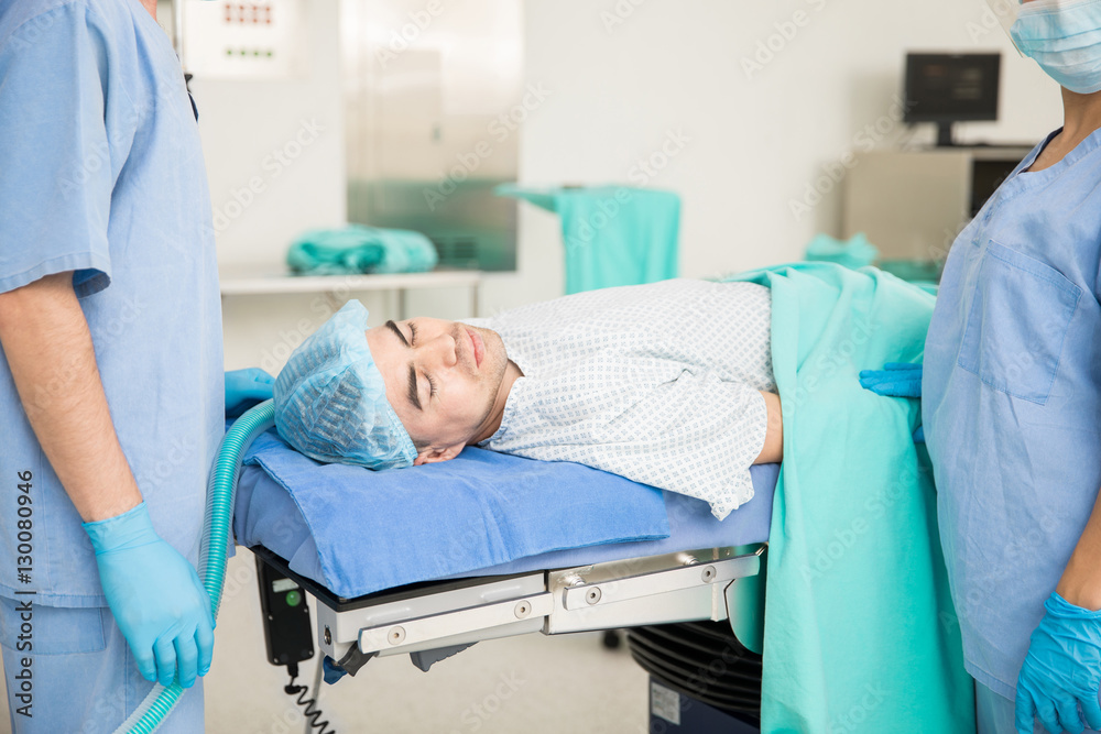Unconscious patient on a hospital bed Stock Photo | Adobe Stock
