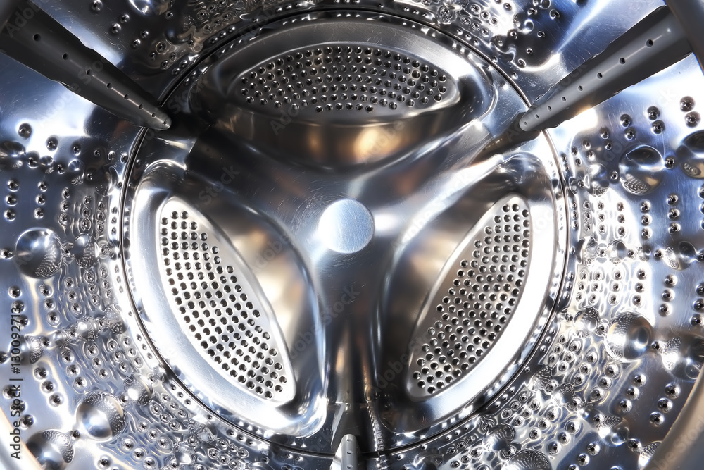 Washing machine inside. Shiny washing machine drum Stock Photo | Adobe ...