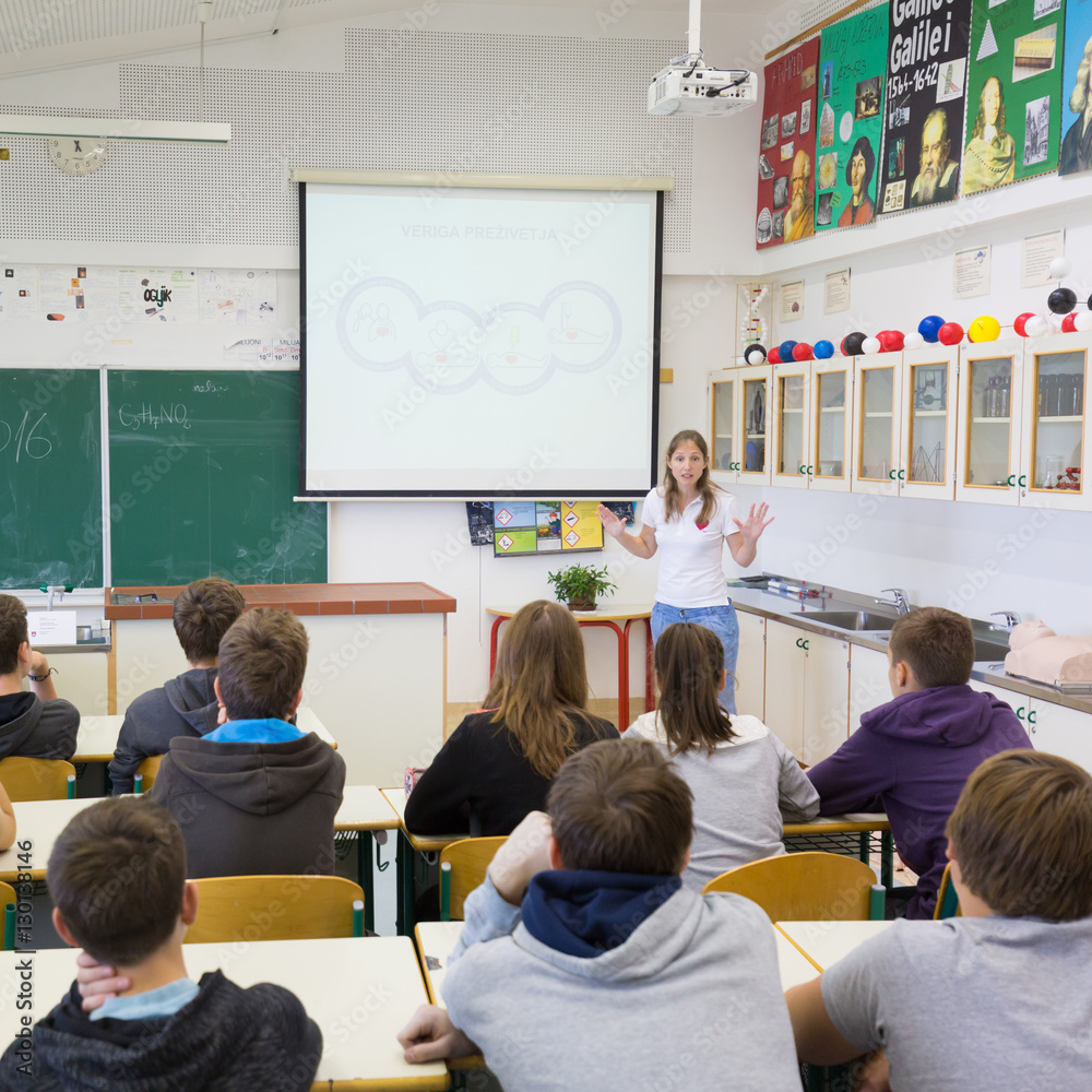 Instructor teaching first aid cardiopulmonary resuscitation course and ...