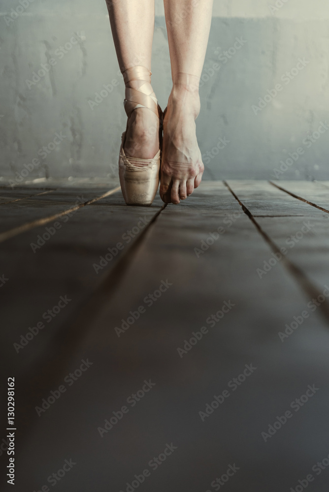 Ballet dancer standing on the tiptoes in the black room Stock Photo ...