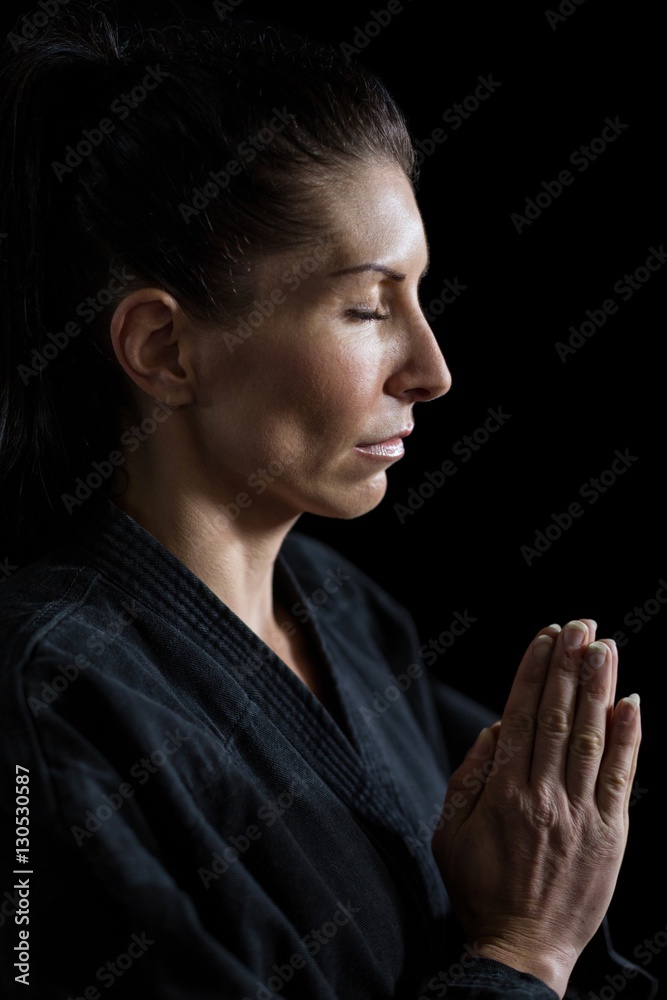 Female karate player in prayer pose Stock Photo | Adobe Stock