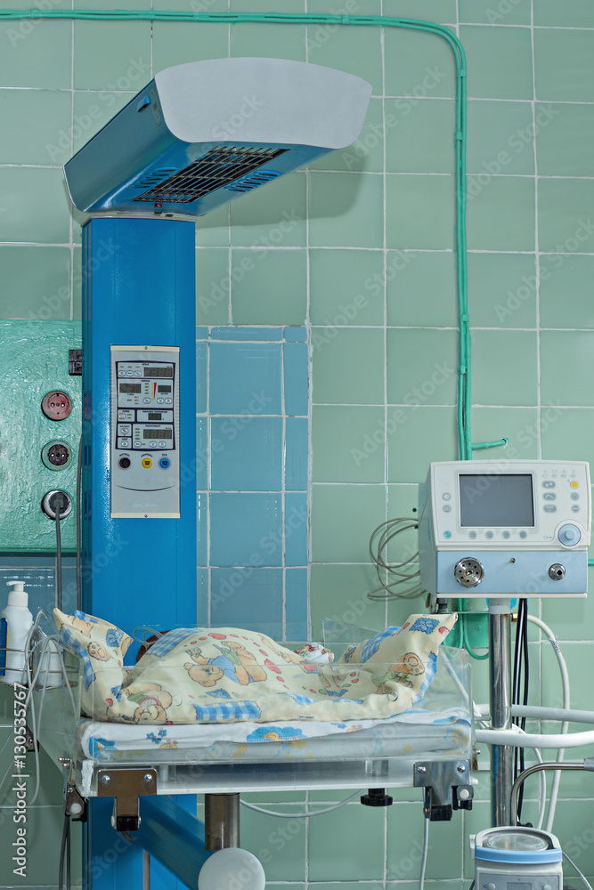 Newborn baby on infant warmer in neonatal intensive care unit Stock ...