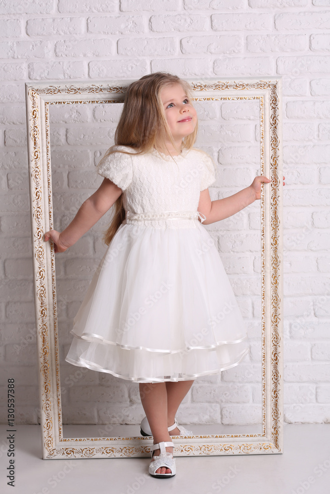 Little girl holding frame. Close up. White background Stock Photo ...