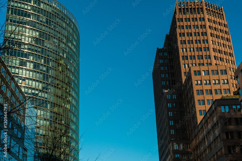 modern office buildings on the left and right side of a big street ...