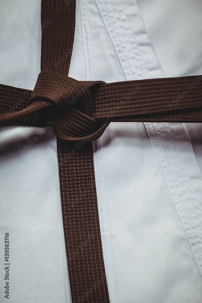 Karate uniform and brown belt Stock Photo | Adobe Stock