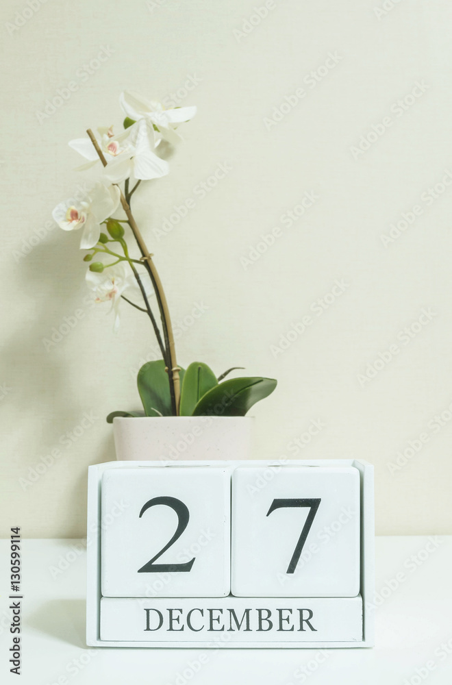Closeup white wooden calendar with black 27 december word with white ...
