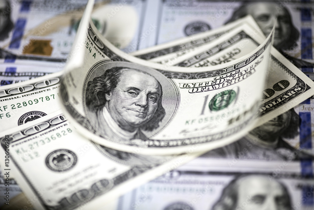 Foto de Three old hundred us dollar bills on the background of modern ...