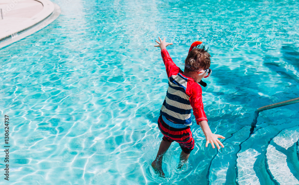 Little boy jumping into swimming pool Stock Photo | Adobe Stock