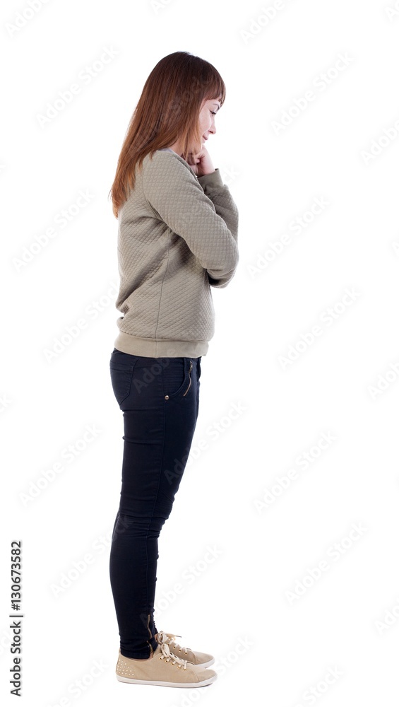 back view of standing young beautiful woman. girl watching. Rear view ...