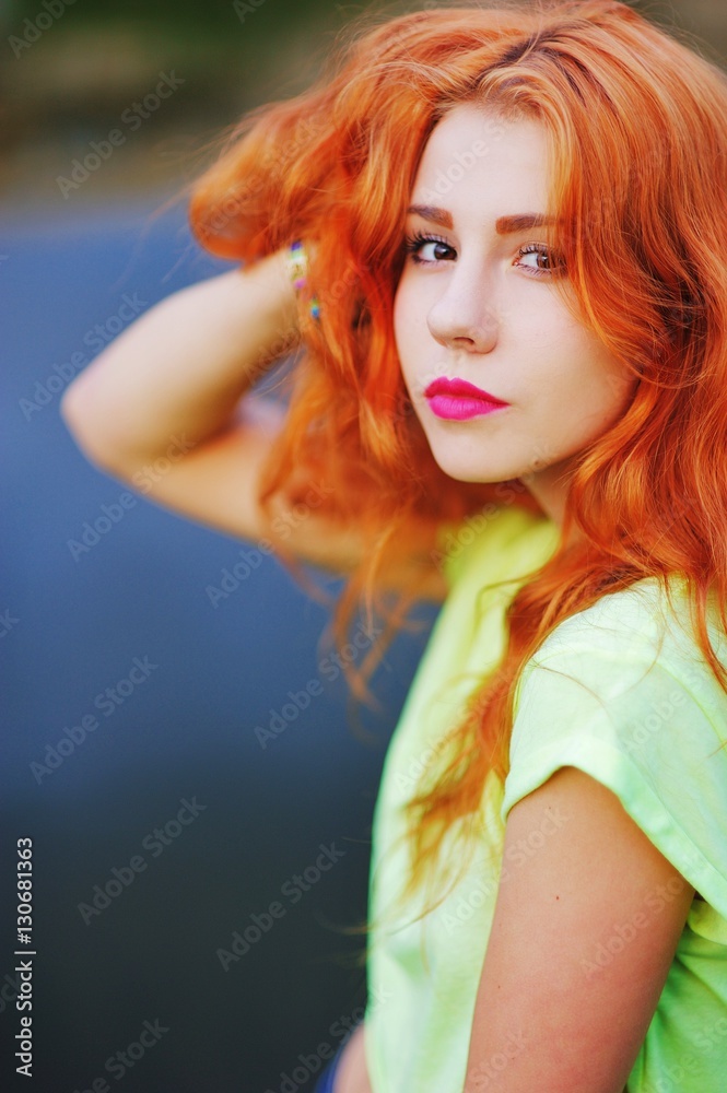 Portrait Of An Adorable Brown Eyed Girl With Her Hand Up Combing
