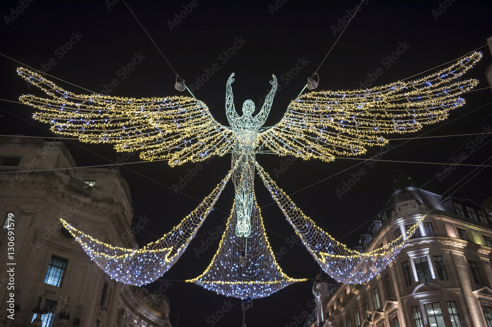 Christmas lights in the shape of a winged angel twinkle in the night ...