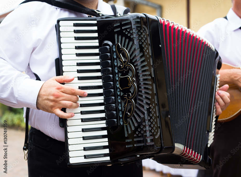 Hand playing accordion closeup Stock Photo | Adobe Stock