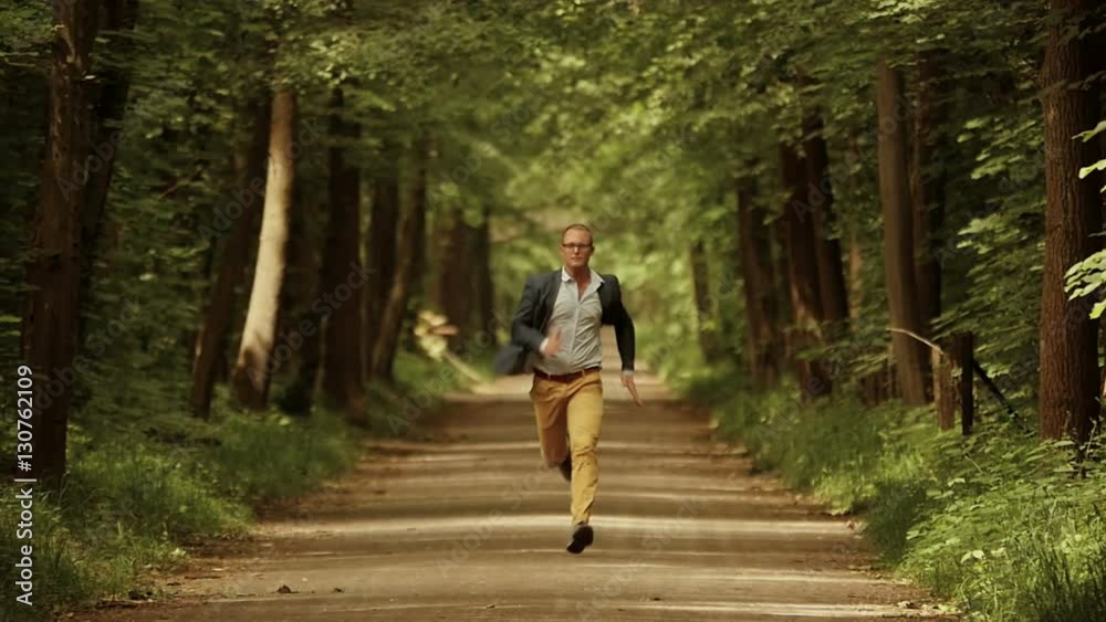 man running fast forward. slow motion of running male person. green ...