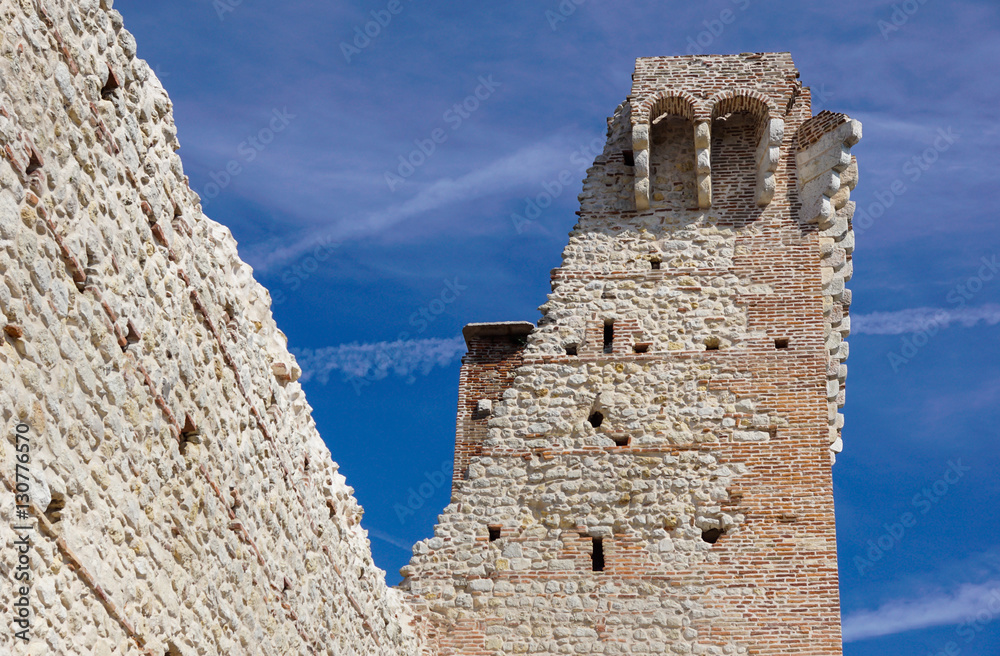 ruins of old medieval castle . fortified wall and tower detail brick ...