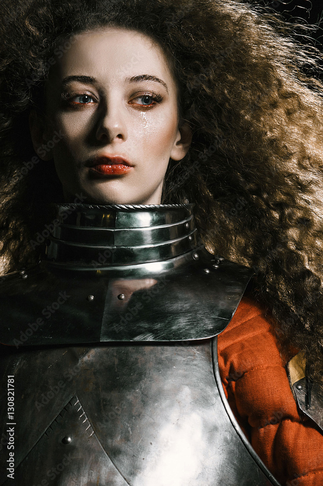 woman warrior in an iron armor crying Stock Photo | Adobe Stock