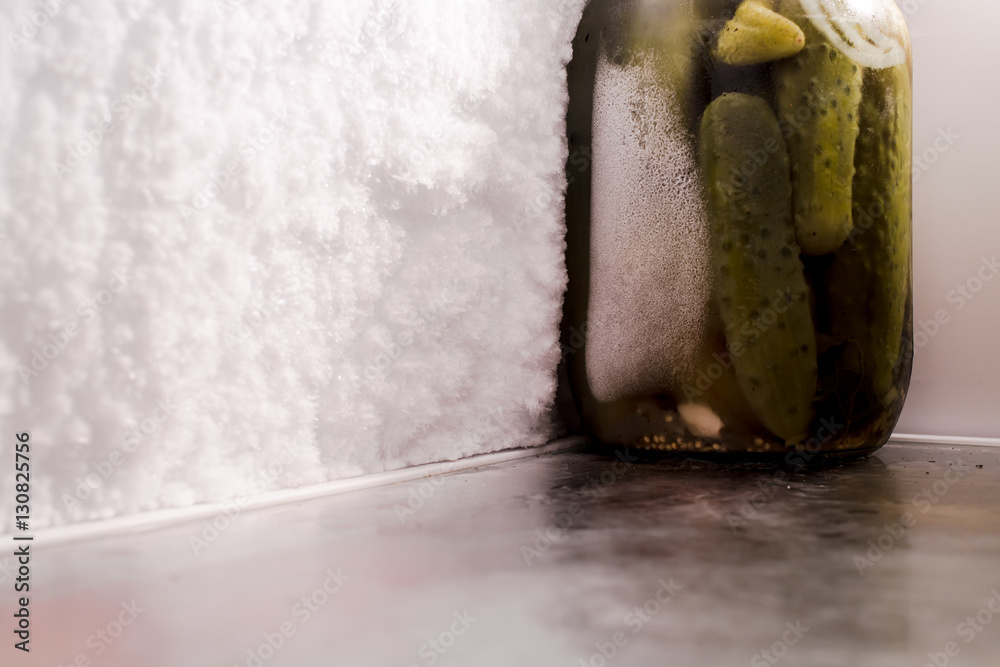 Ice formation on the inner surface of the refrigerator is the result of ...