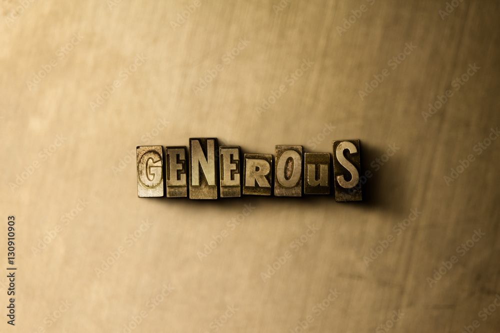 GENEROUS - close-up of grungy vintage typeset word on metal backdrop ...